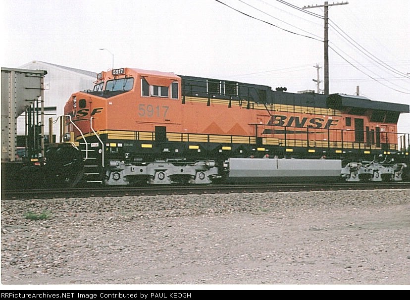 BNSF 5917 rear DPU with BNSF 5932 crosses Carlin Junction.